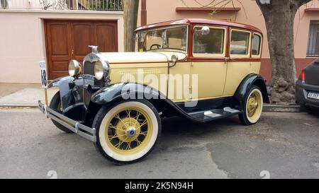 Old cream 1930s Ford Model A Fordor sedan three window hardtop parked ...