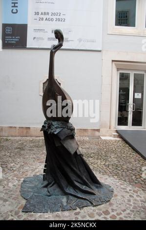 Statue of a musical instrument near Arco de Almedina, Coimbra, Portugal ...