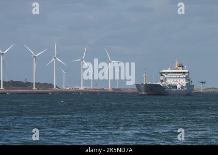 Ship entering the waterway near the Hook of Holland passing by onshore ...