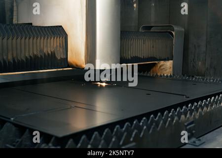 heavy industrial laser cutter during metal sheet processing Stock Photo ...