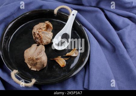Black garlic made by fermenting process. Fermented foods. Healthy food ...