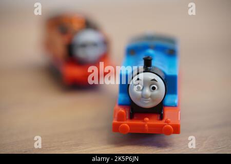 A Mattel brand toy model locomotive with a face from the Thomas And ...