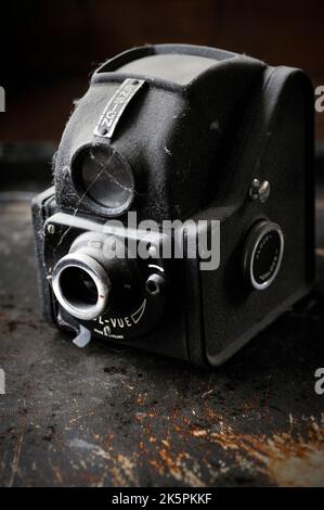 Old fashioned dusty vintage camera isolated on white background ...