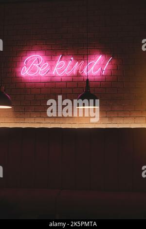 Neon sign of word BE KIND in the interior bar, Concept of relaxing ...