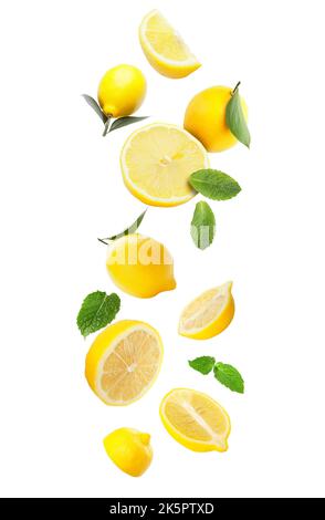 Isolated flying lemons. Falling sliced lemon fruit isolated on white ...
