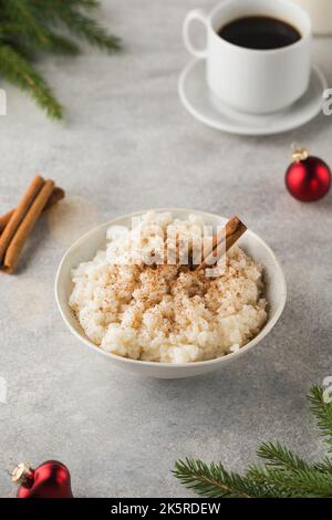 Scandinavian rice porridge with cinnamon in a bowl surrounded by ...