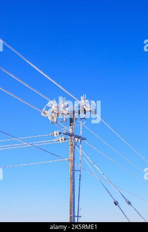 hoar frost covered electricity transmission lines snow covered prairie ...
