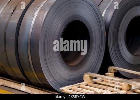 Metail coils stacked in a company warehouse. Steel hot roll coil at ...