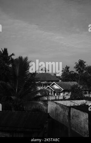 Remote Mosque, Monochrome photo of a mosque building squeezed between ...