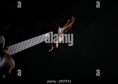 Another chords. String Cuatro instrument recording session, closeup ...