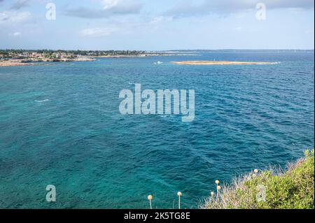 The beautiful Ognina beach in Syracuse with turquoise and green water ...