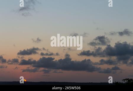 Sun disk during sunset. Isolated clouds in the sky. Skies replacement ...