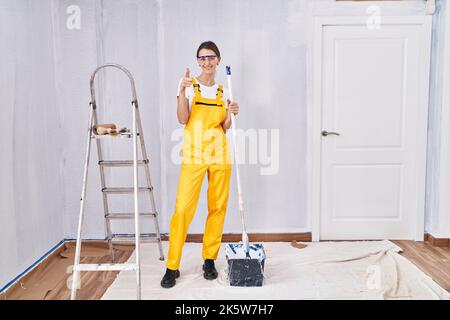 young female decorator showing funny faces Stock Photo - Alamy