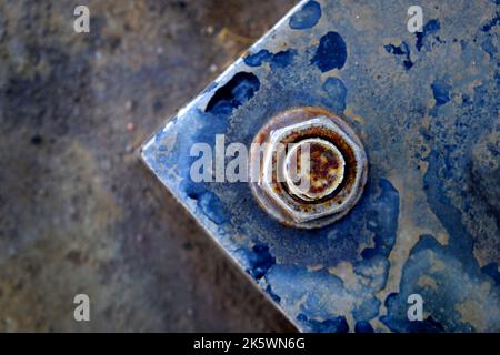 Strong large bolt and nut securing metal to ground strength Stock Photo ...