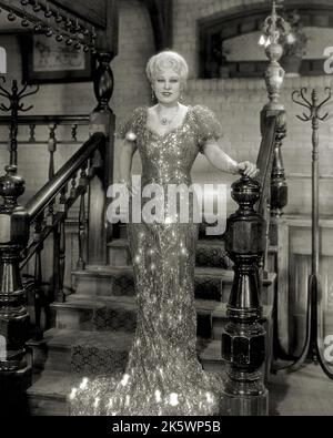 Mae West, an iconic American actress and comedian, is captured here in ...