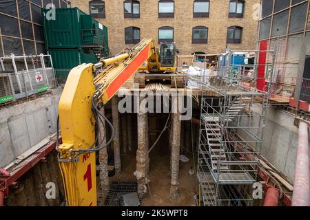 Construction site basement excavation with temporary propping, concrete ...