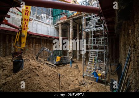 Construction site basement excavation with temporary propping, concrete ...