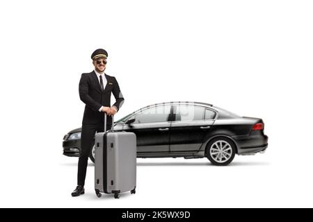 Full length portrait of a chauffeur with a suitcase in front of a black ...