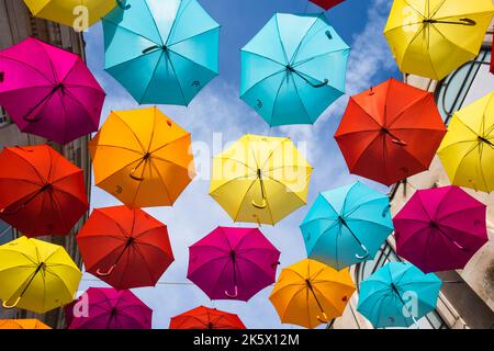 Suspended umbrellas inside a London building Stock Photo - Alamy