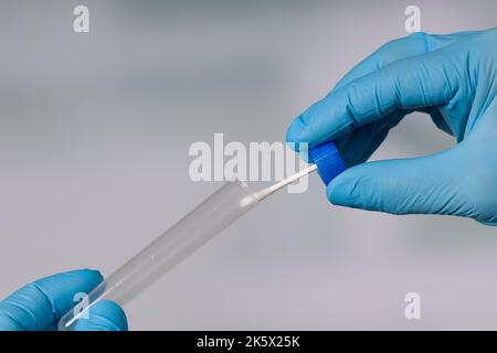Close up of handling a Corona smear test in a medical laboratory Stock ...