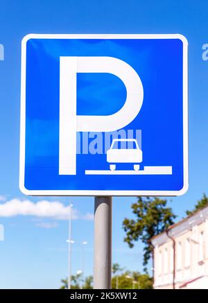 a Closeup of a blue parking sign Stock Photo - Alamy