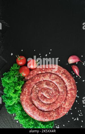 Raw meat pork and beef swirl sausages for grill Stock Photo - Alamy