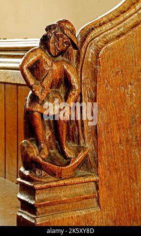 Medieval bench end, Anger, Seven Deadly Sins, man with knife in Jaws of ...