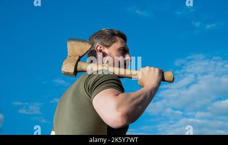 back view of man with axe. woodman man hold ax. brutal man on sky ...