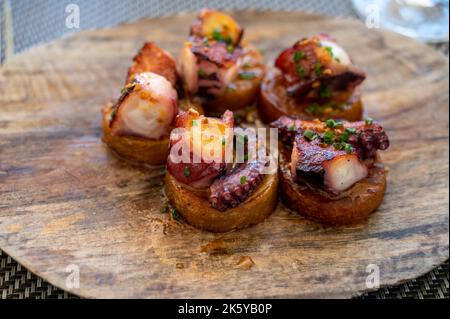 Spanish starter dish in fish restaurant in Getaria, grilled octopus ...
