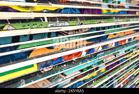 Old faded comic book collection stacked in a pile creates a colorful ...