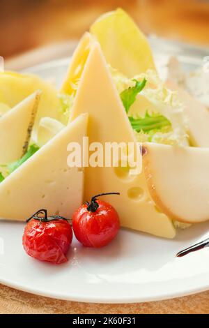 Delicious and healthy salad with a variety of cheeses and tomatoes ...