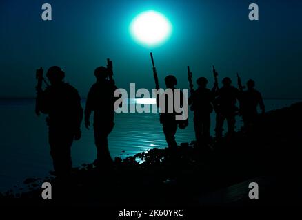 Army soldiers with rifles moon night silhouette in action during raid ...