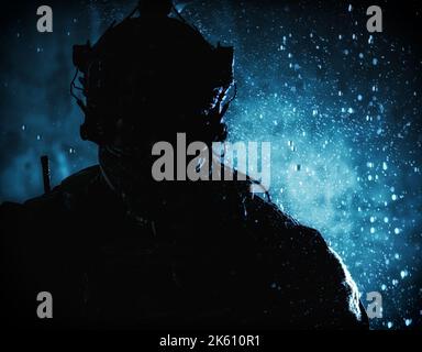 Commando fighter wearing a helmet with night vision, sneaking in the ...