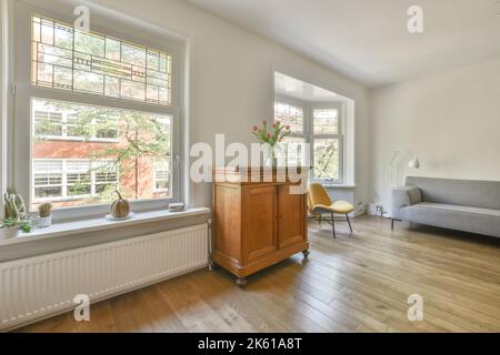 Interior of living room with stylish lamps, armchair and commode Stock ...