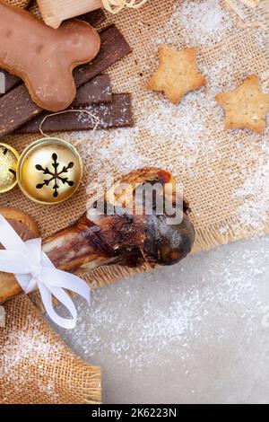 Dog treats flat lay on grey with imitation snow and copy space, rustic ...