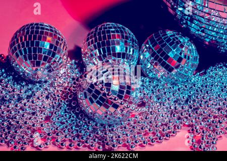 disco balls for decorationof a party on pink background Stock Photo - Alamy