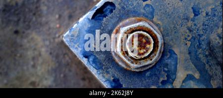 Strong large bolt and nut securing metal to ground strength Stock Photo ...