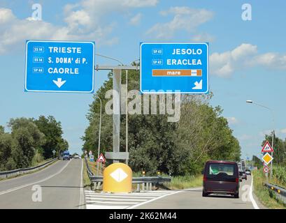 road signs at the crossroads with ITALIAN LOCALITIES written in large ...