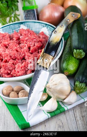 Fresh ingredients to cook stuffed zucchini with beef meat on the ...