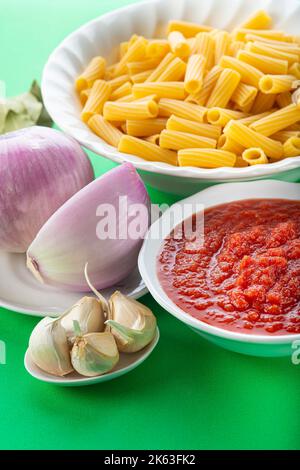 Raw ngredients for cooking tortiglioni bolognese pasta Stock Photo - Alamy