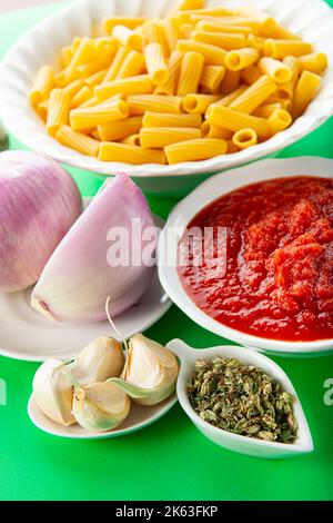 Raw ngredients for cooking tortiglioni bolognese pasta Stock Photo - Alamy