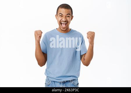 Win, triumphing people. Happy arab man cheering, celebrating victory ...