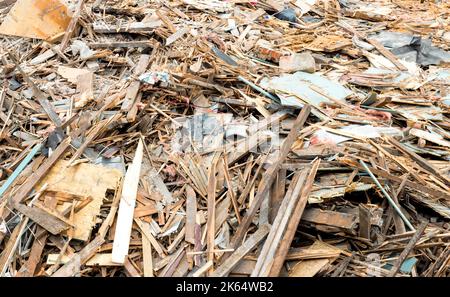 Pile of wood debris at a building demolition site. Construction waste ...