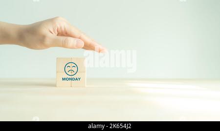 Avoid feeling down on blue Monday concept. Protection wooden cubes with ...