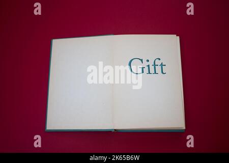 Gift word in opened book with vintage, natural patterns old antique ...