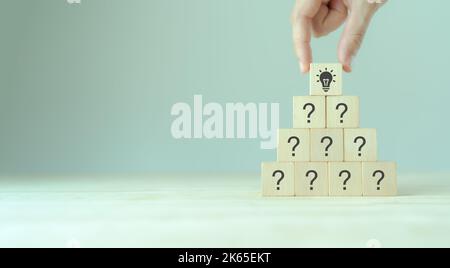 Question marks and light bulb symbolizing idea or solution. Problem ...