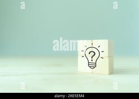 Question marks and light bulb symbolizing idea or solution. Problem ...
