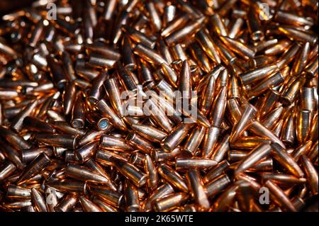 Large caliber copper shells pile for riffle as background Stock Photo ...