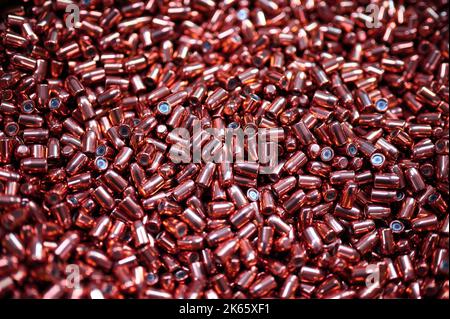 Brass metal bullets pile for weapons as background Stock Photo - Alamy