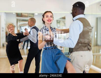 Man and woman performing jazz dance in dancing room Stock Photo - Alamy